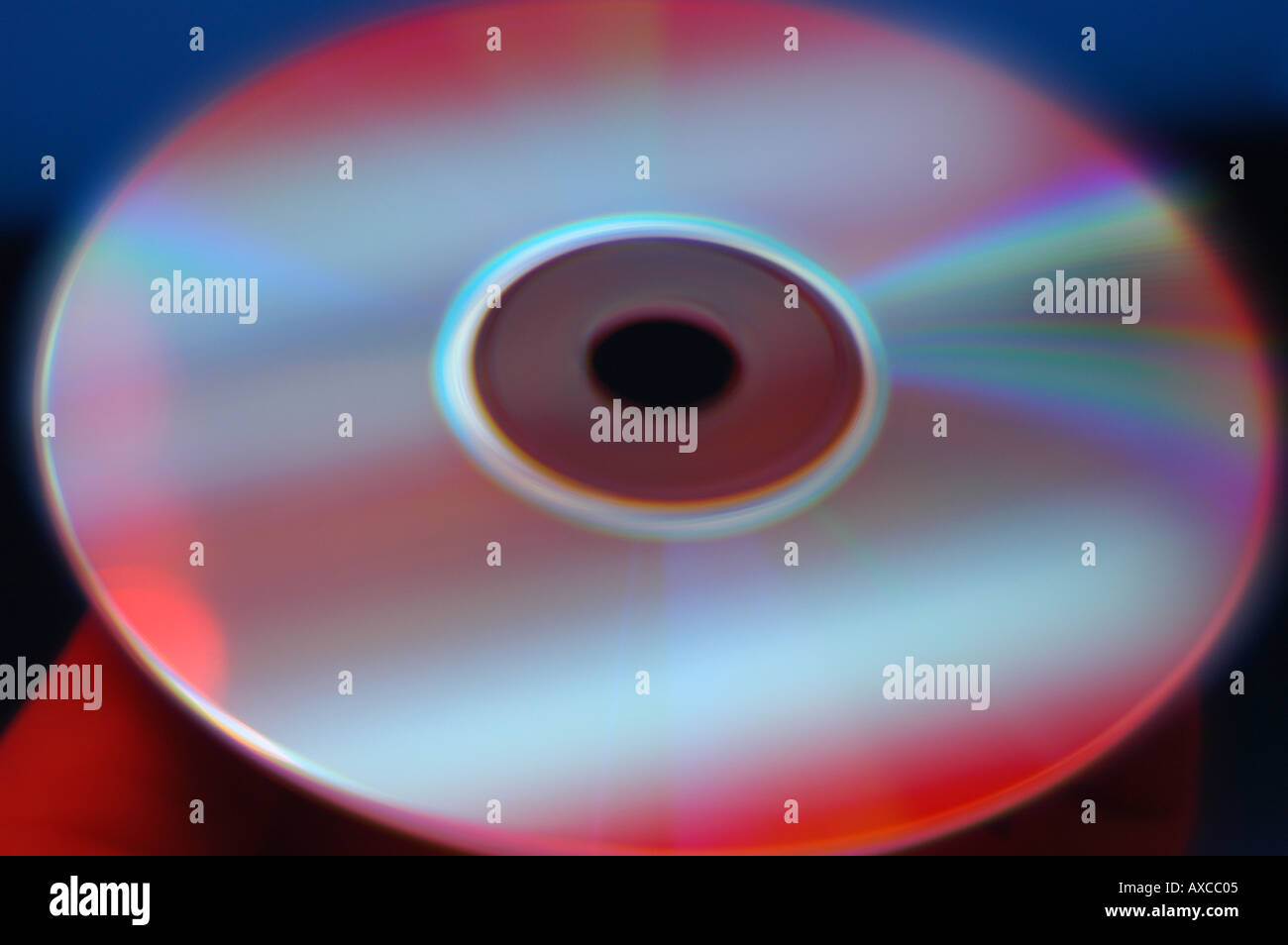 Computer disc in hand with red and blue saturated colors Stock Photo ...