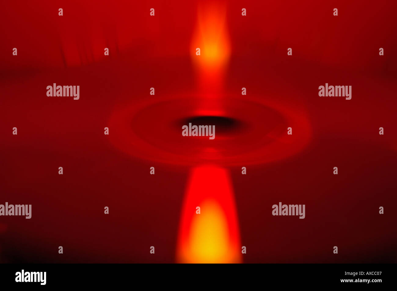 computer disc bathed in red light high color saturation Stock Photo - Alamy