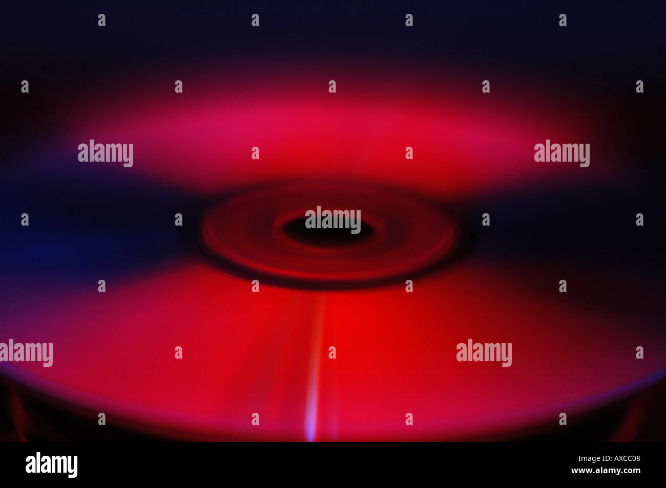 information concept computer disc bathed in red and blue light high ...