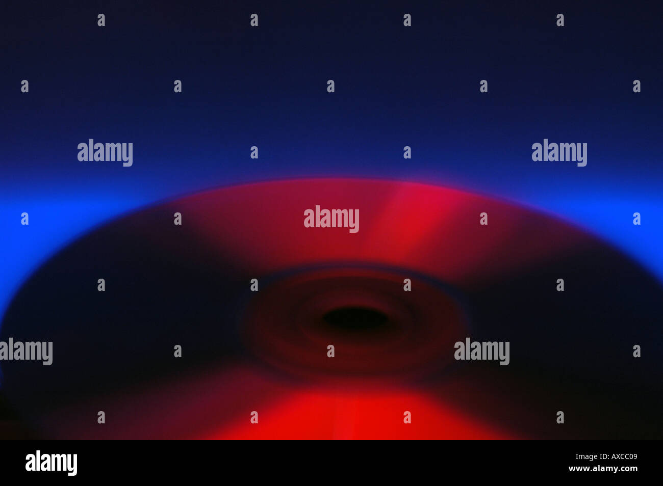 computer disc bathed in red and blue light high color Stock Photo - Alamy
