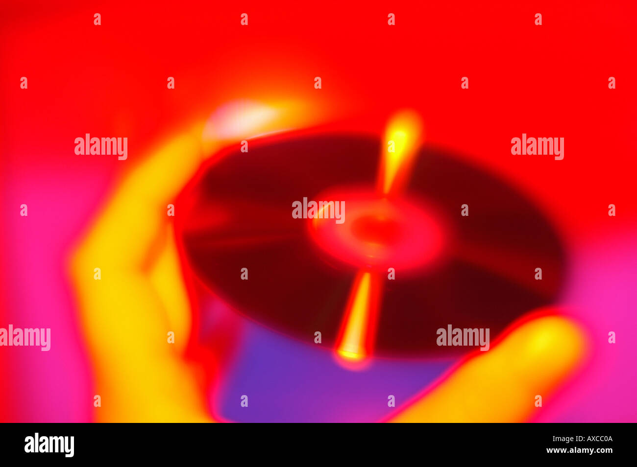 stylized computer disc in hand bold red color Stock Photo - Alamy