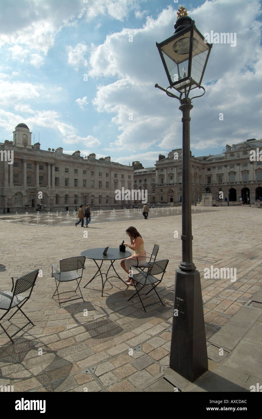 Somerset House The Strand London lady relaxing at outdoor tables with ...
