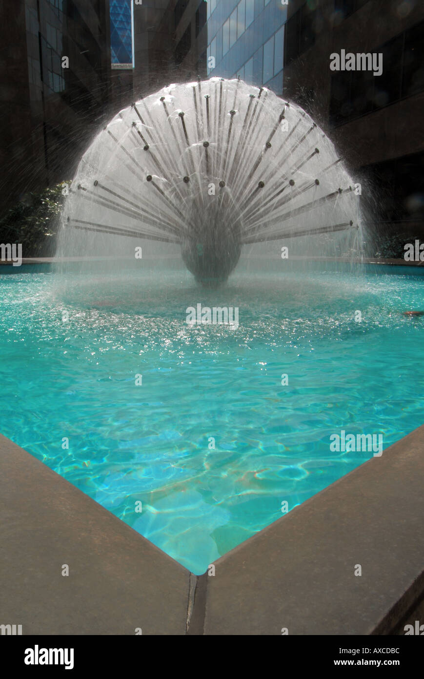 City of London water fountain in pedestrian square within modern office ...