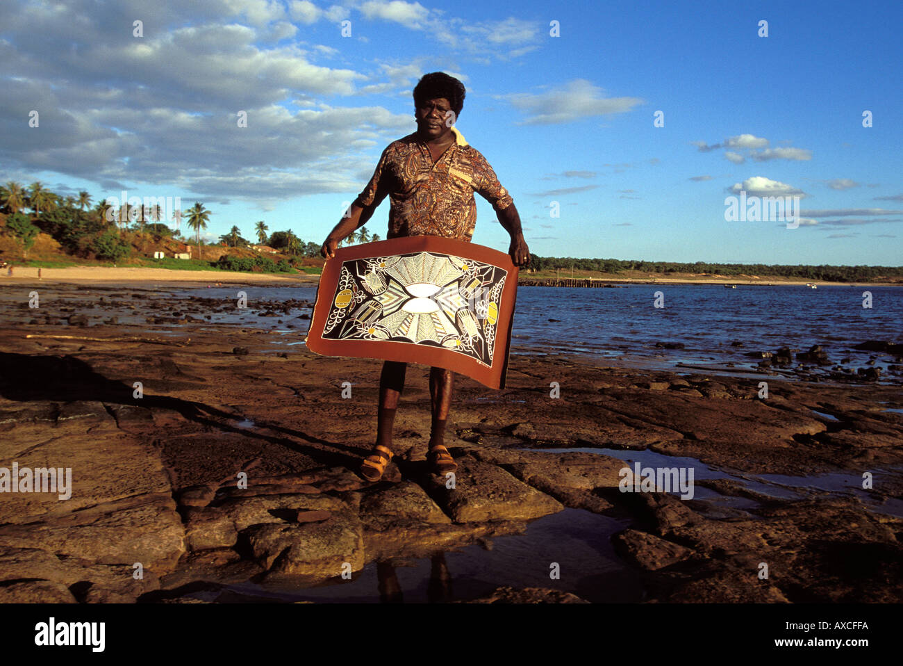 Aboriginal artist Terry Yumbulul with paintings at Galiwinku Island NT ...
