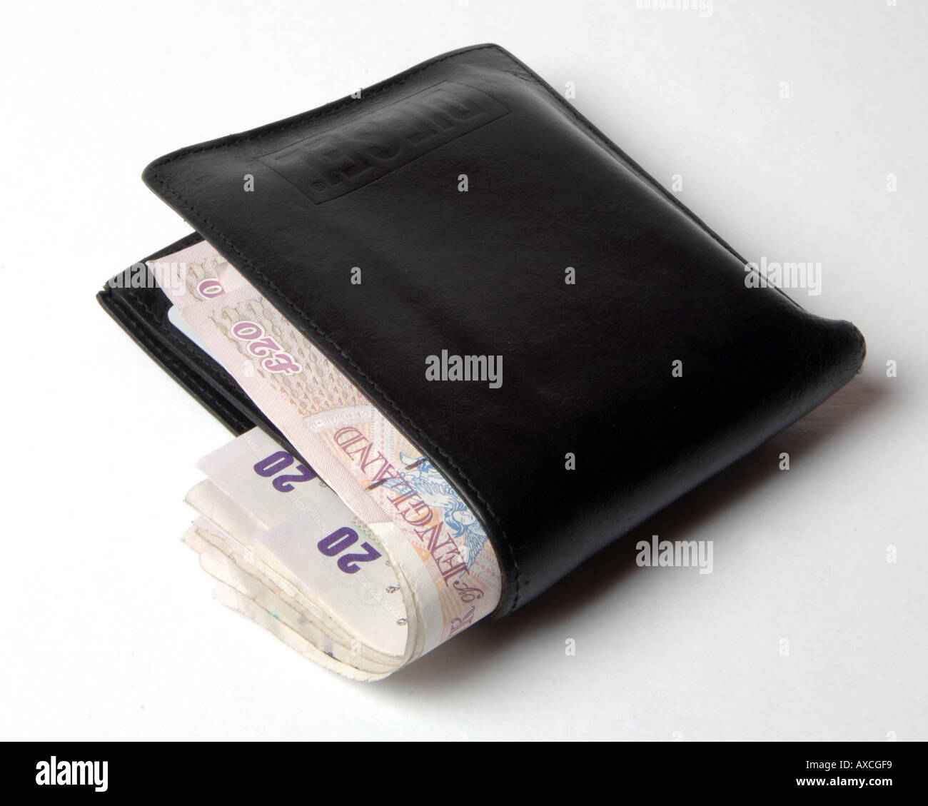 wallet stuffed with cash Stock Photo - Alamy