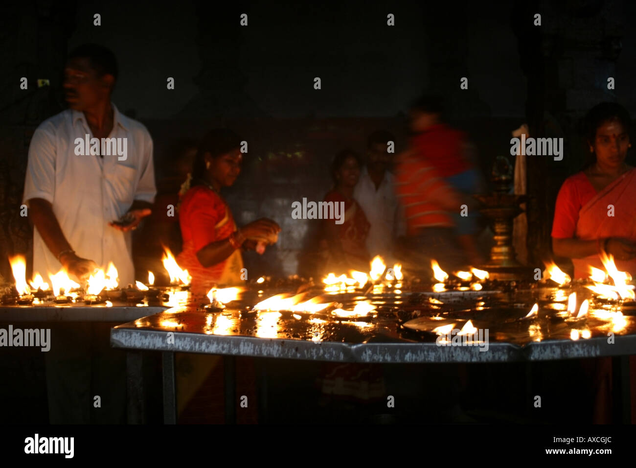 Candles being lit at a temple in India Stock Photo - Alamy