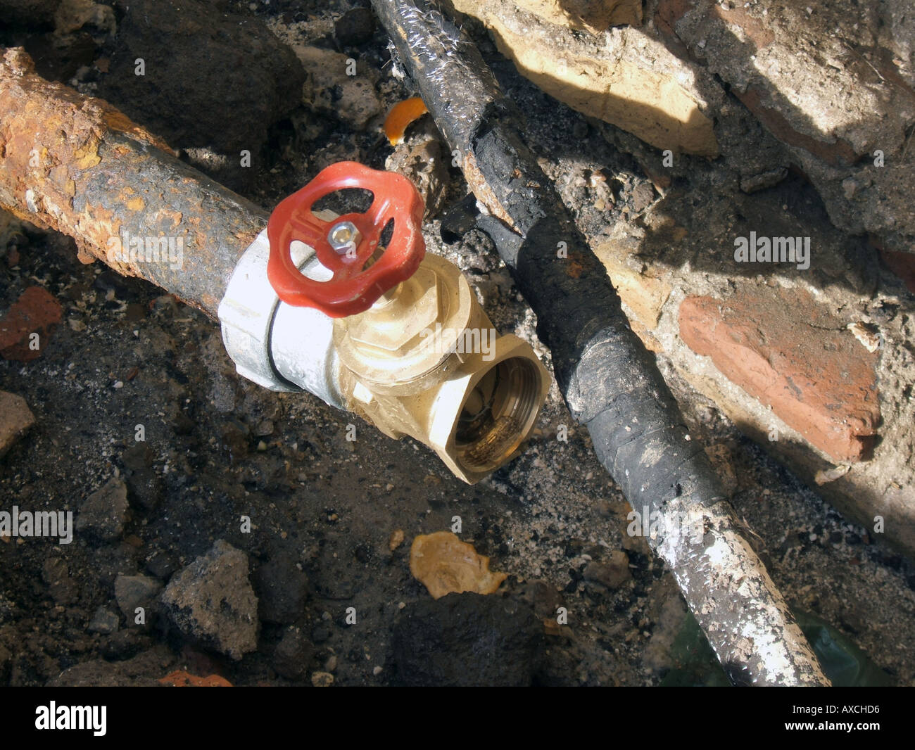 broken gas-water pipe Stock Photo - Alamy