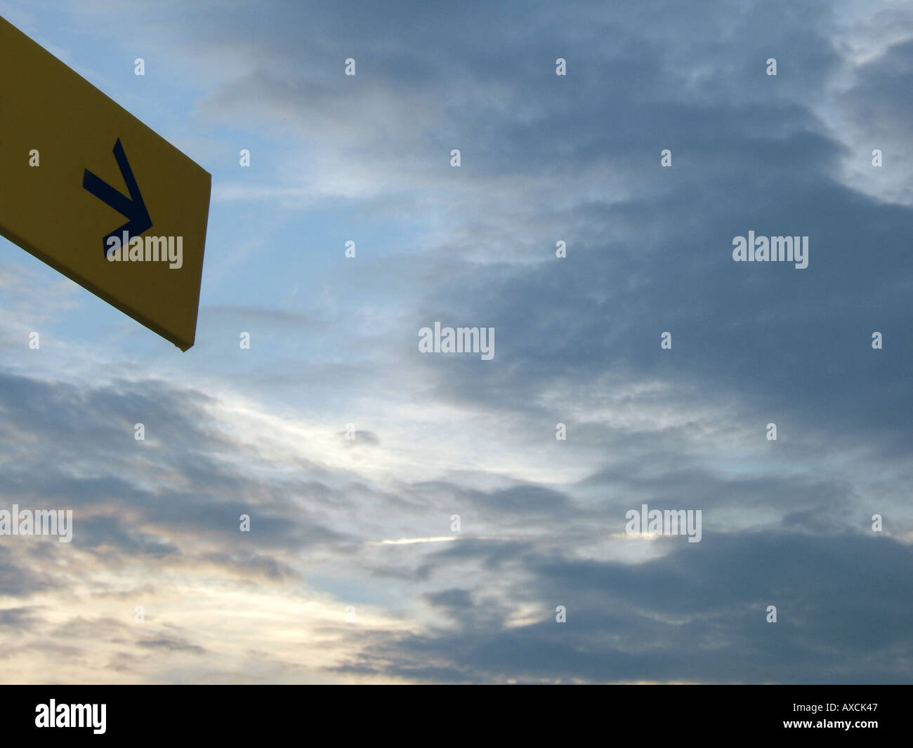 arrow on sign and empty sky Stock Photo - Alamy