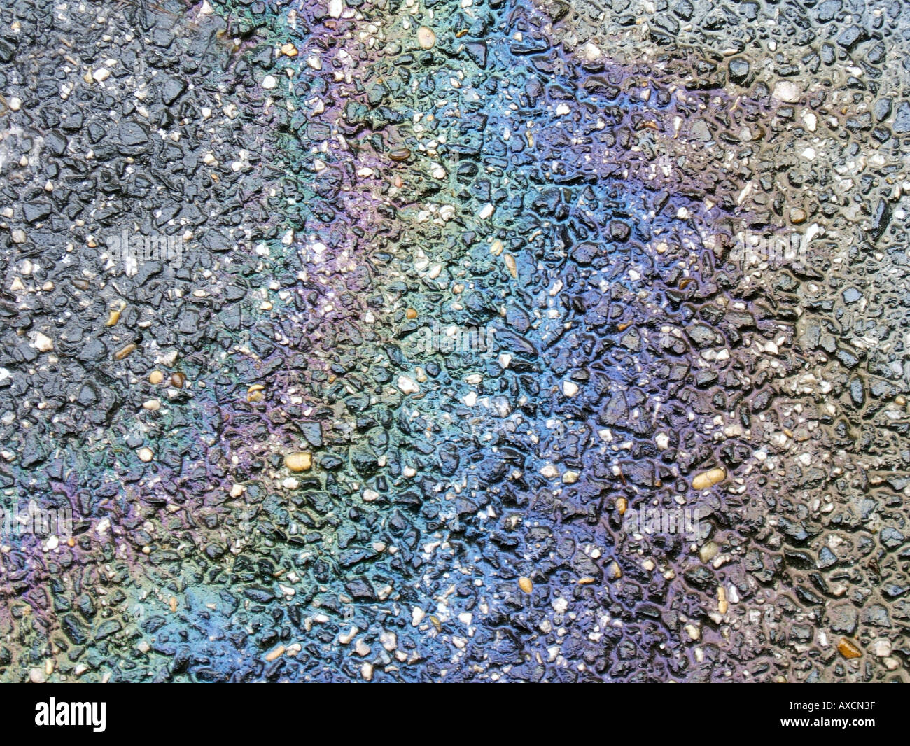 oil spilt on road surface Stock Photo - Alamy