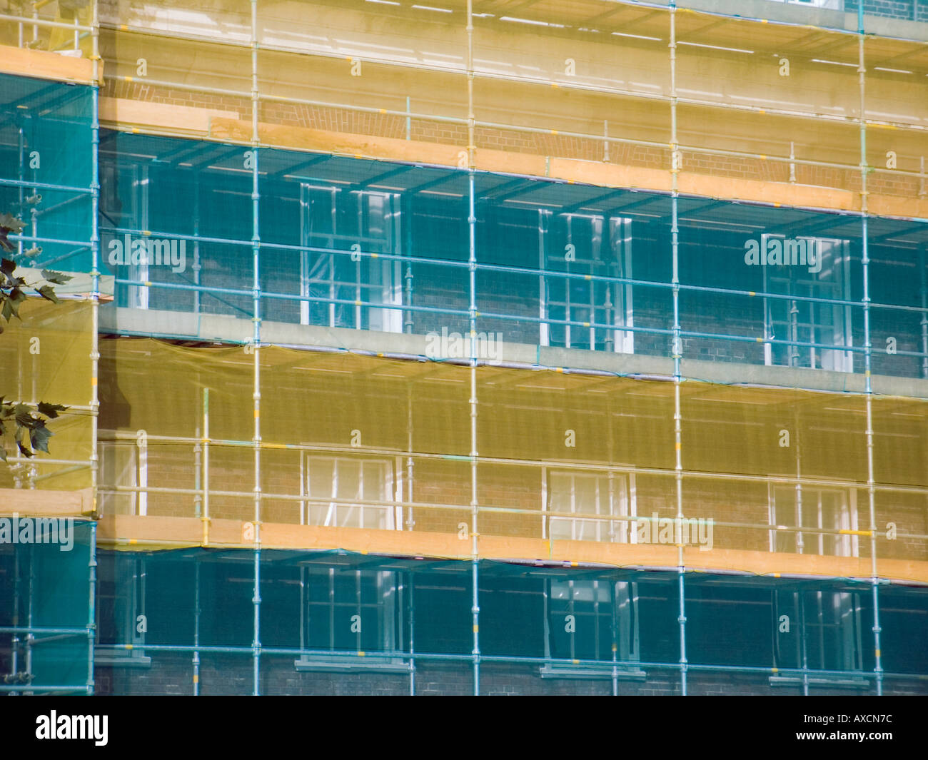 Green and yellow scaffolding London Stock Photo - Alamy