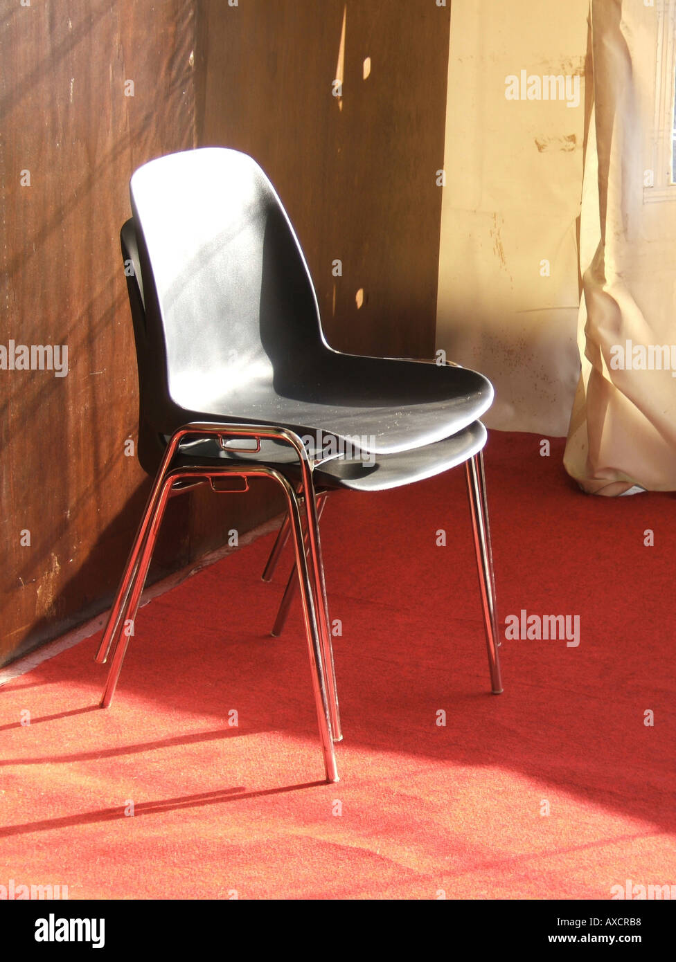 two chairs stacked Stock Photo - Alamy