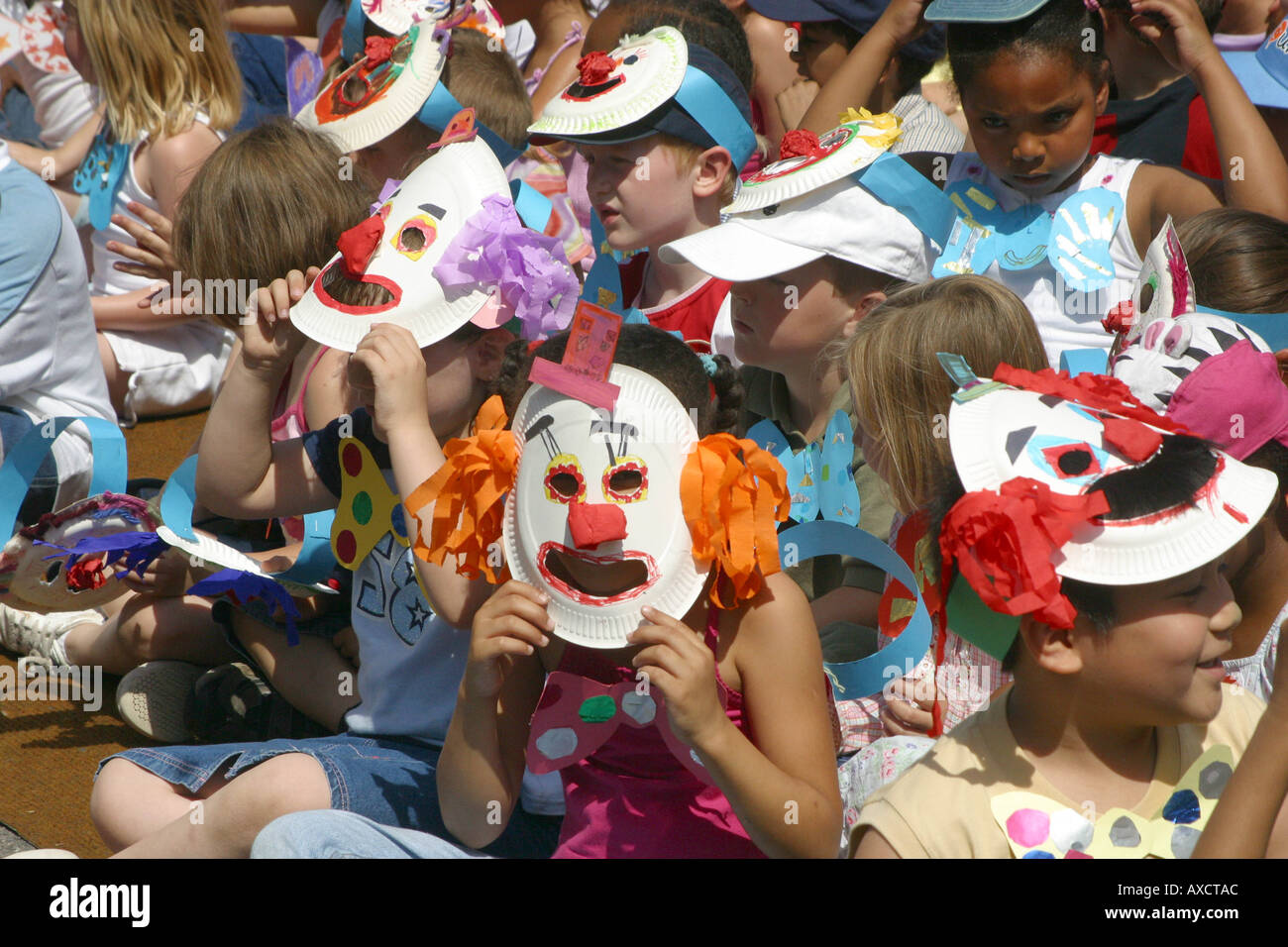 primary school summer fete playground scene with children playing with ...