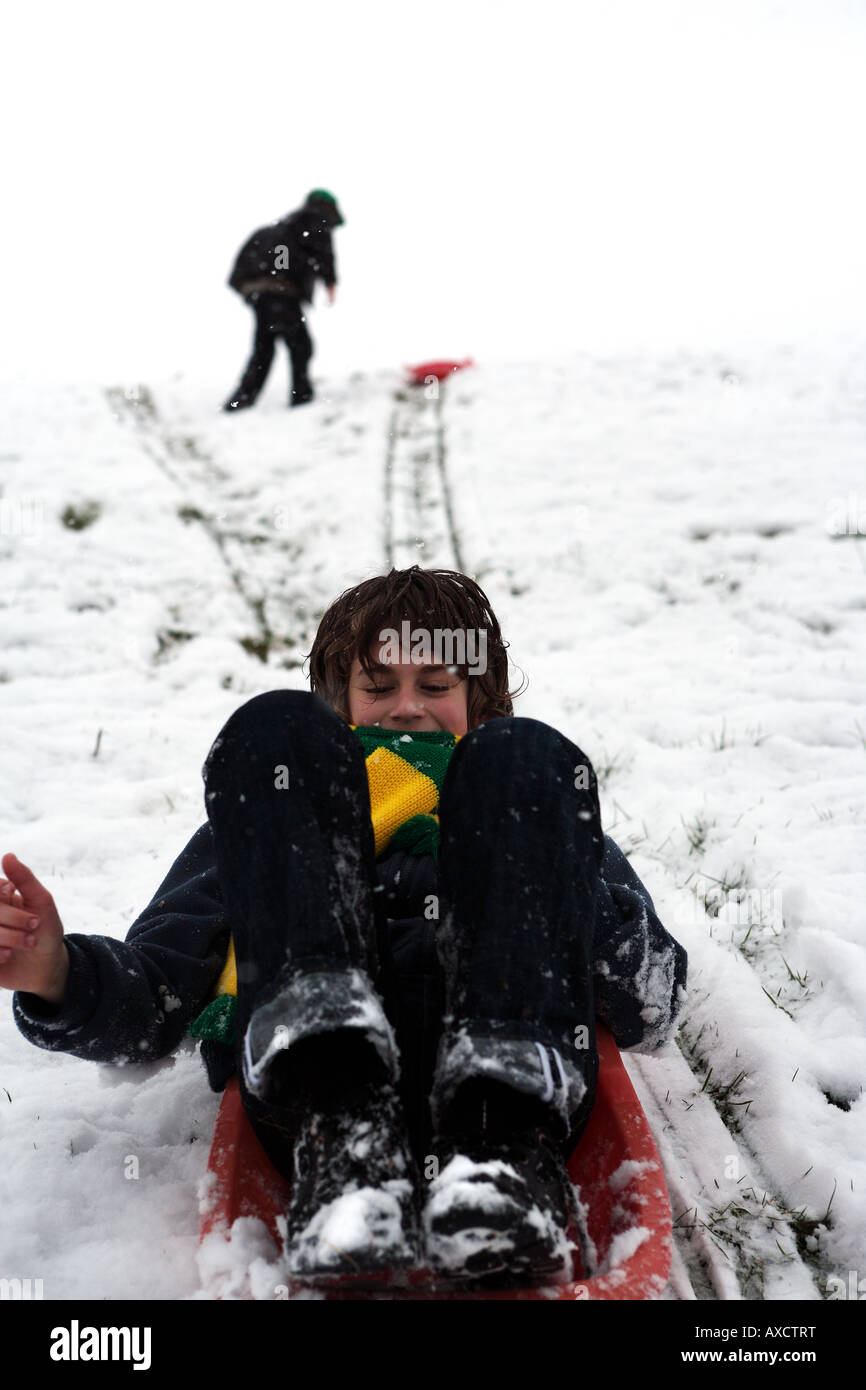 Boys sledging hi-res stock photography and images - Alamy