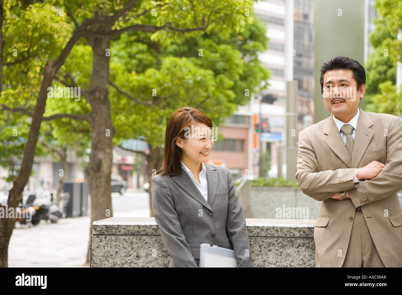 Two business people talking Stock Photo - Alamy Two business people talking Stock Photo - Alamy