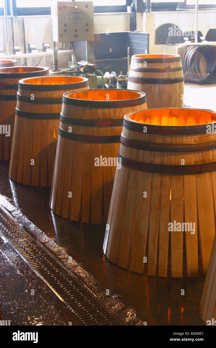 Burning, toasting the barrel with fire. Cooperage, barrel manufacturing ...