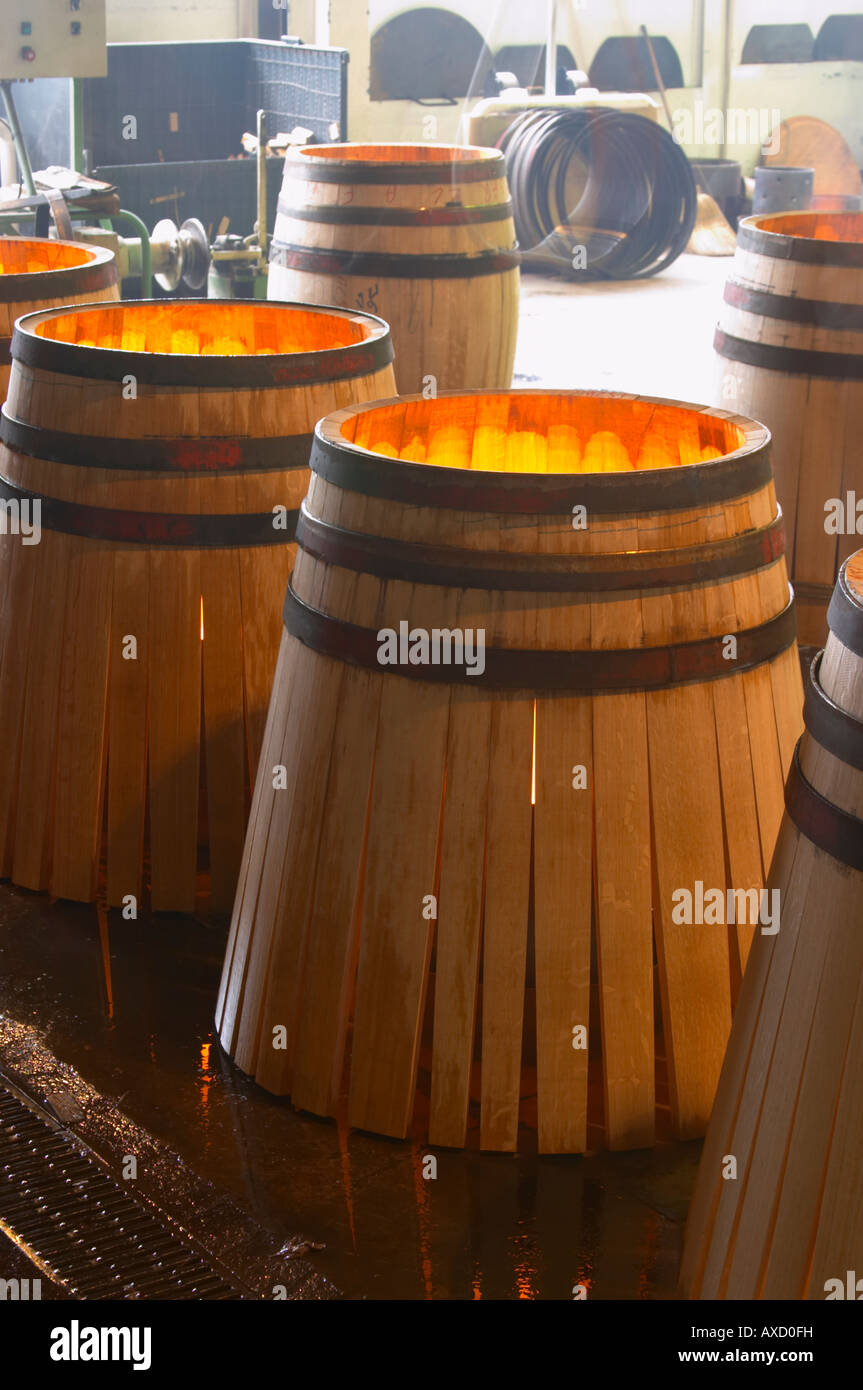Burning, toasting the barrel with fire. Cooperage, barrel manufacturing ...