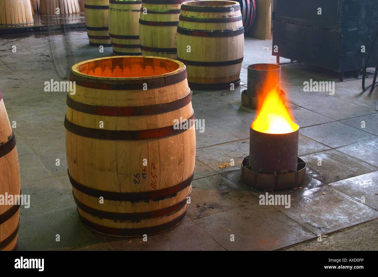 Burning, toasting the barrel with fire. Cooperage, barrel manufacturing ...