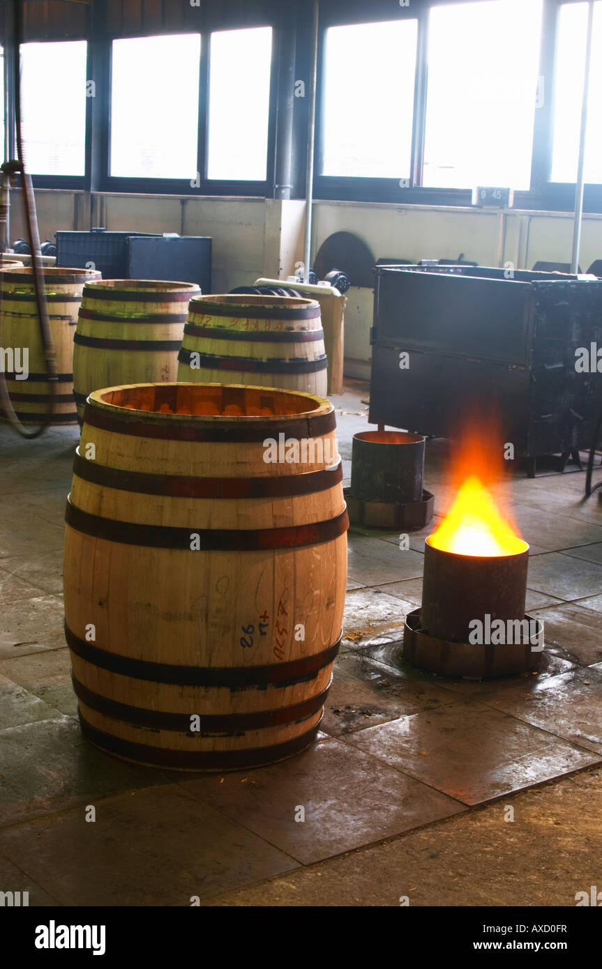Burning, toasting the barrel with fire. Cooperage, barrel manufacturing ...