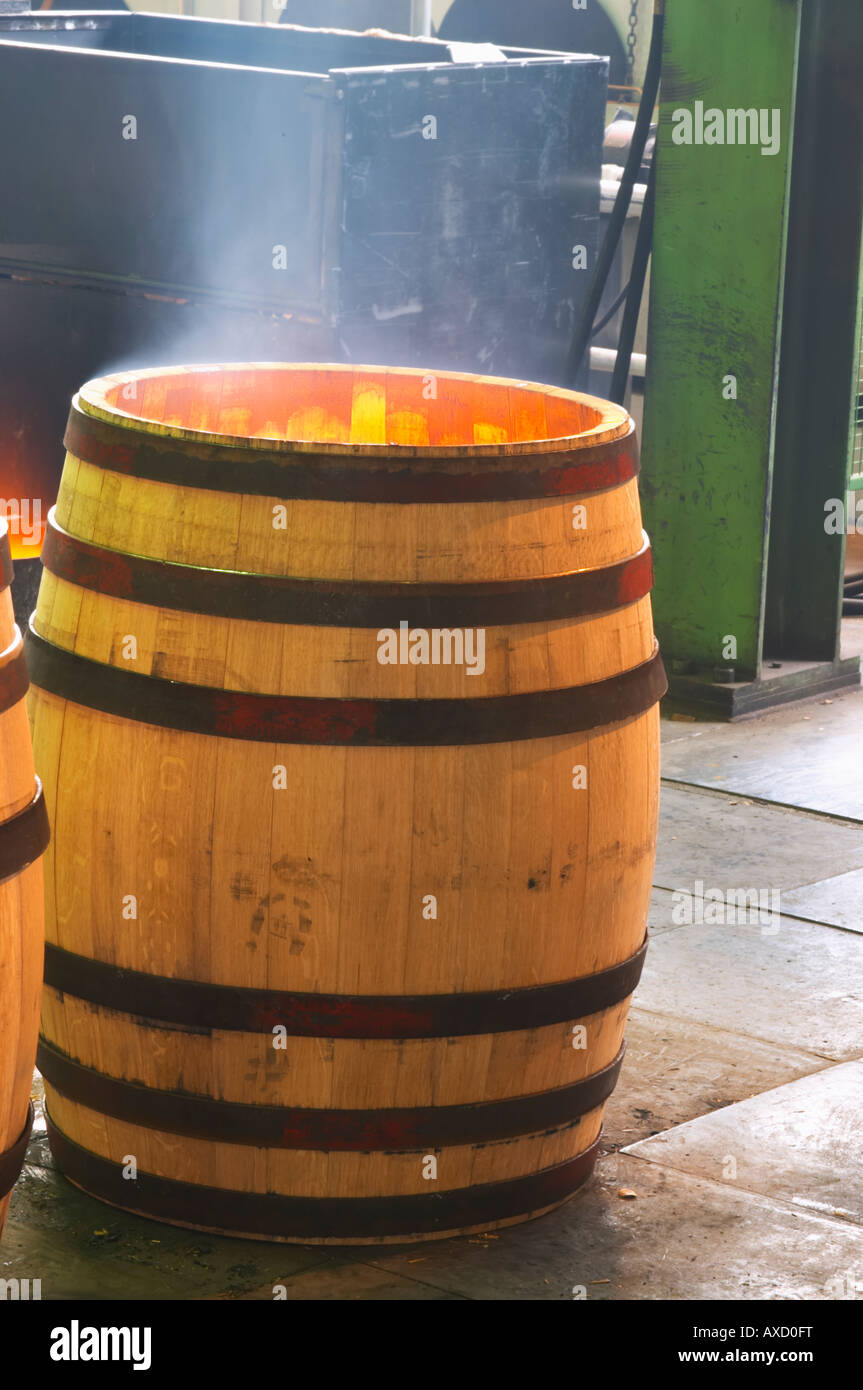 Burning, toasting the barrel with fire. Cooperage, barrel manufacturing ...