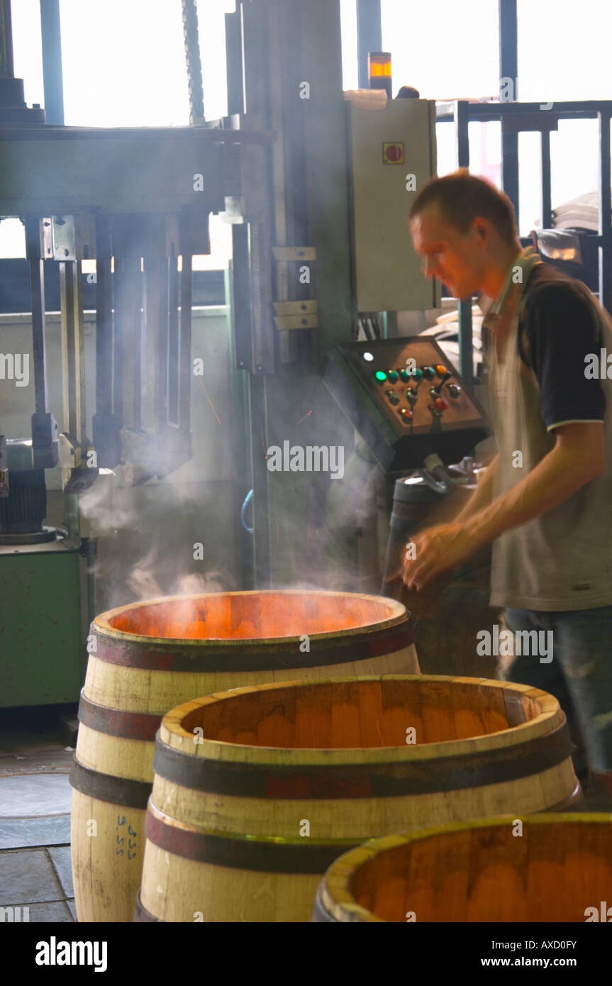 Burning, toasting the barrel with fire. Cooperage, barrel manufacturing ...