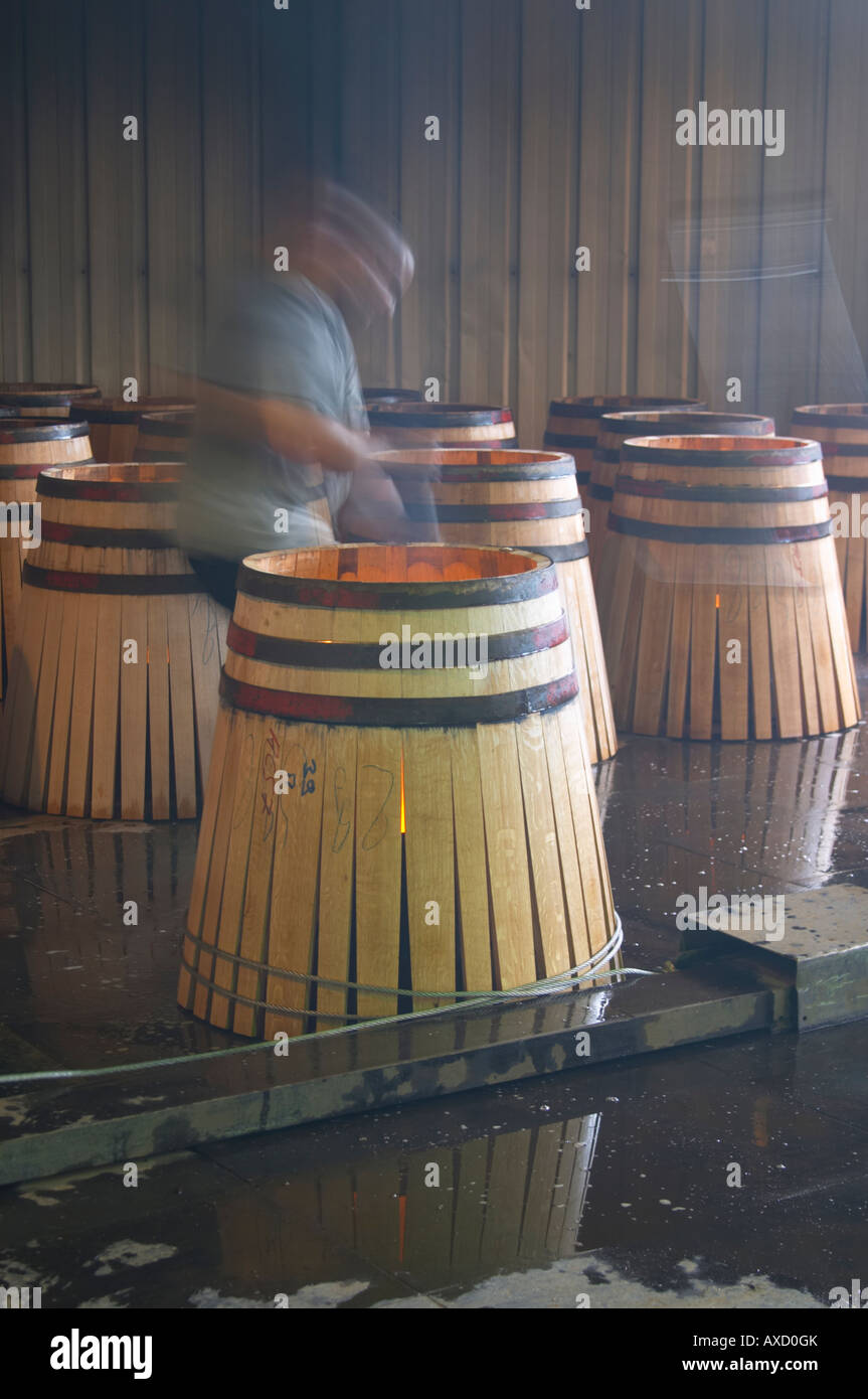 Burning, toasting the barrel with fire. Cooperage, barrel manufacturing ...