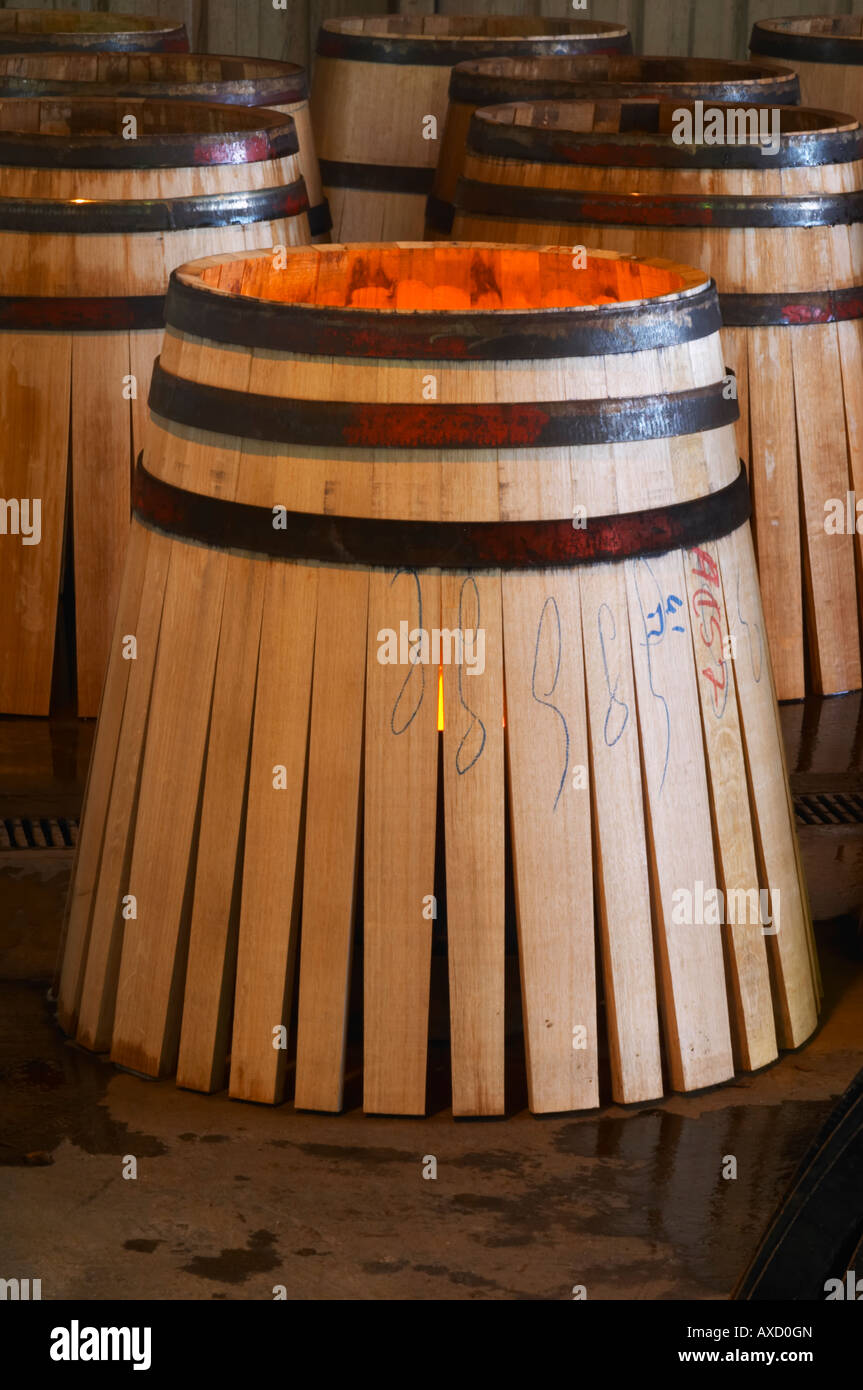 Burning, toasting the barrel with fire. Cooperage, barrel manufacturing ...