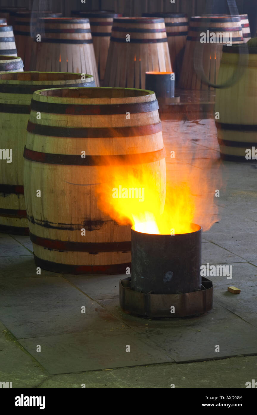 Burning, toasting the barrel with fire. Cooperage, barrel manufacturing ...
