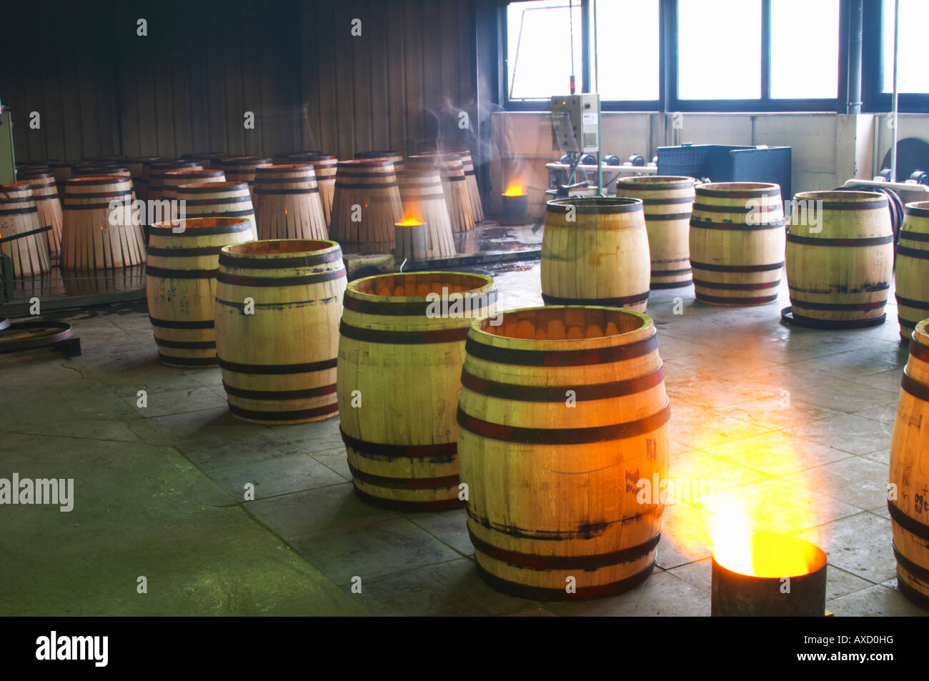 Burning, toasting the barrel with fire. Cooperage, barrel manufacturing ...