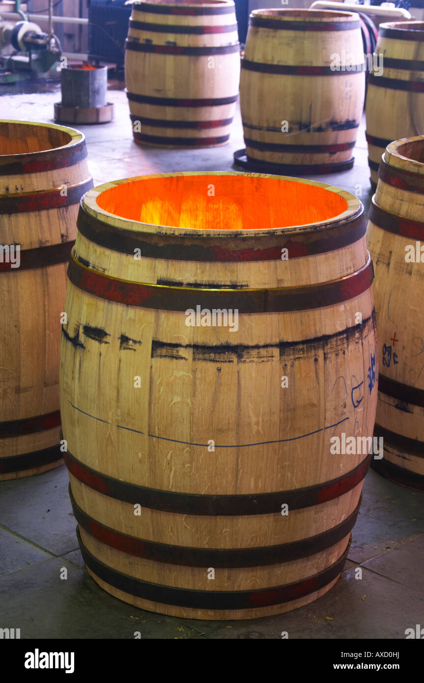Burning, toasting the barrel with fire. Cooperage, barrel manufacturing ...