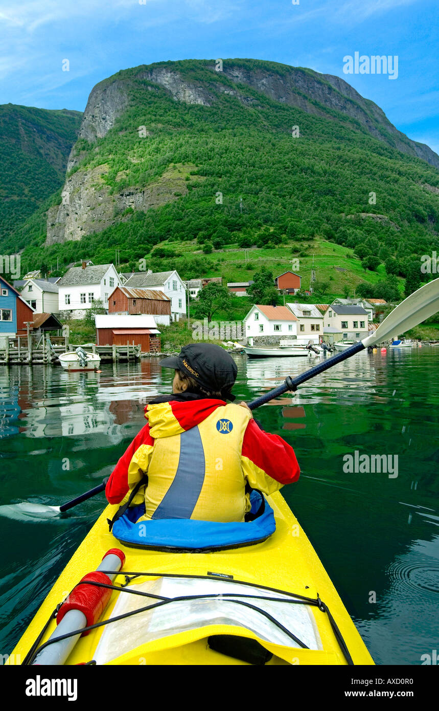 Kayaking in Naeroyfjord.Unesco World Heritage site.Undredal village ...