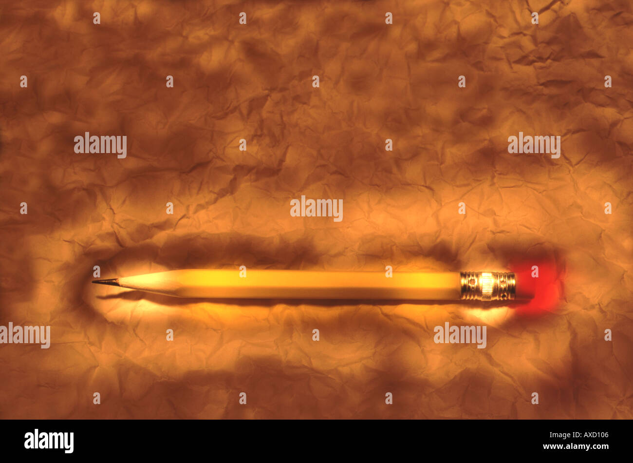 Glowing Pencil on Crumpled Paper Stock Photo - Alamy