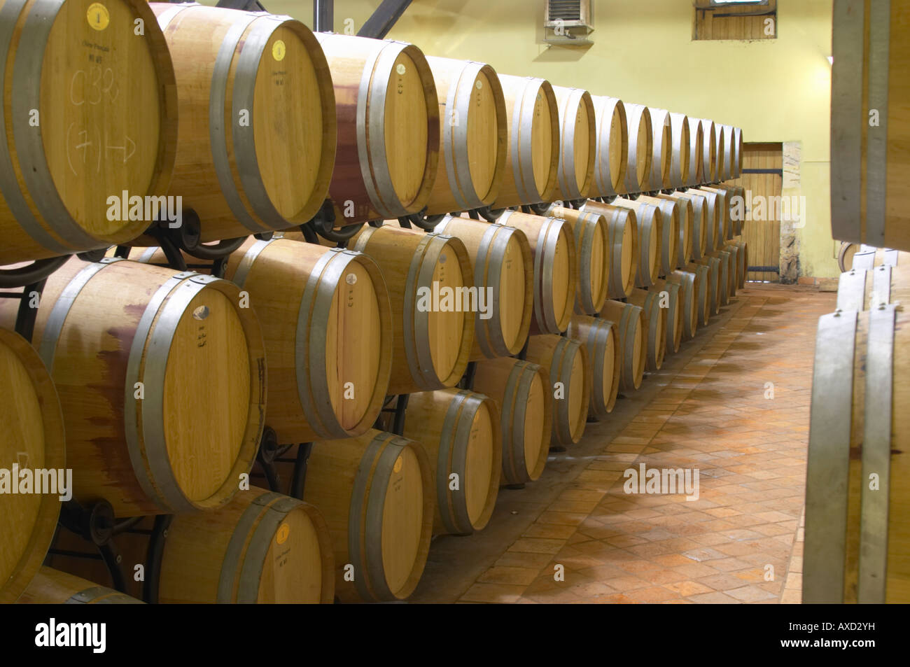 Oak barrel aging and fermentation cellar. Chateau Reignac, Bordeaux ...