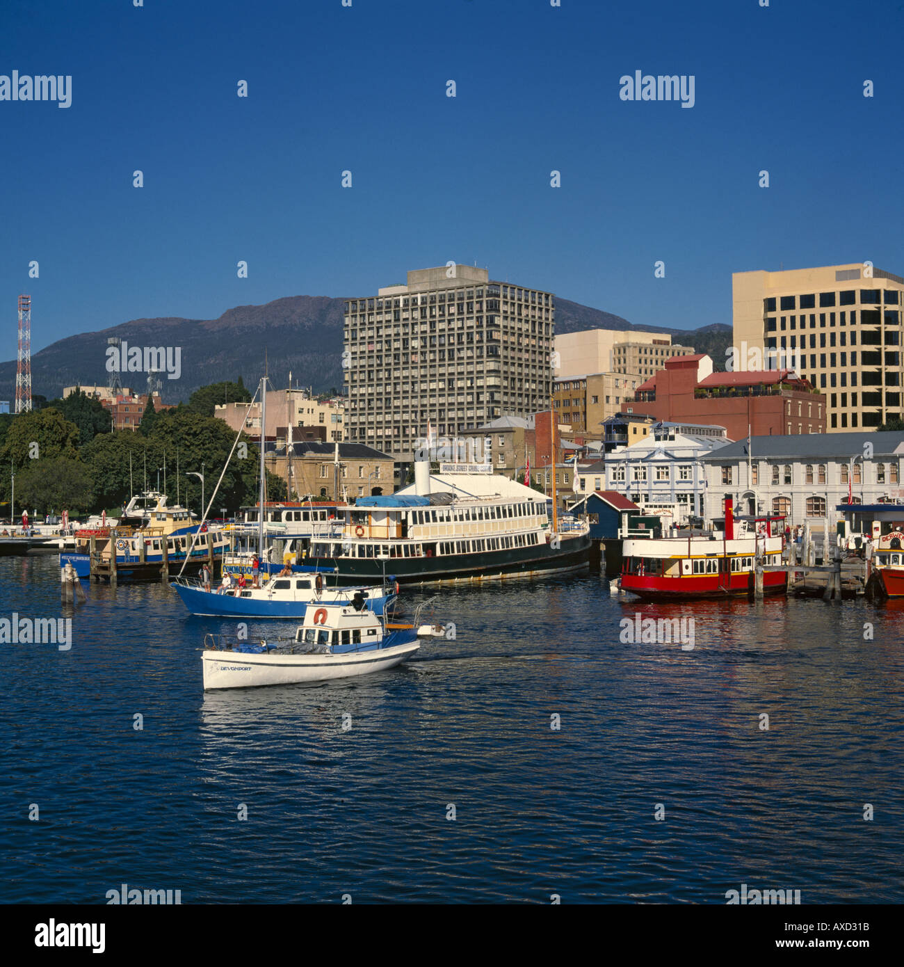 The harbour and quayside of Sullivan’s Cove with old style white blue ...