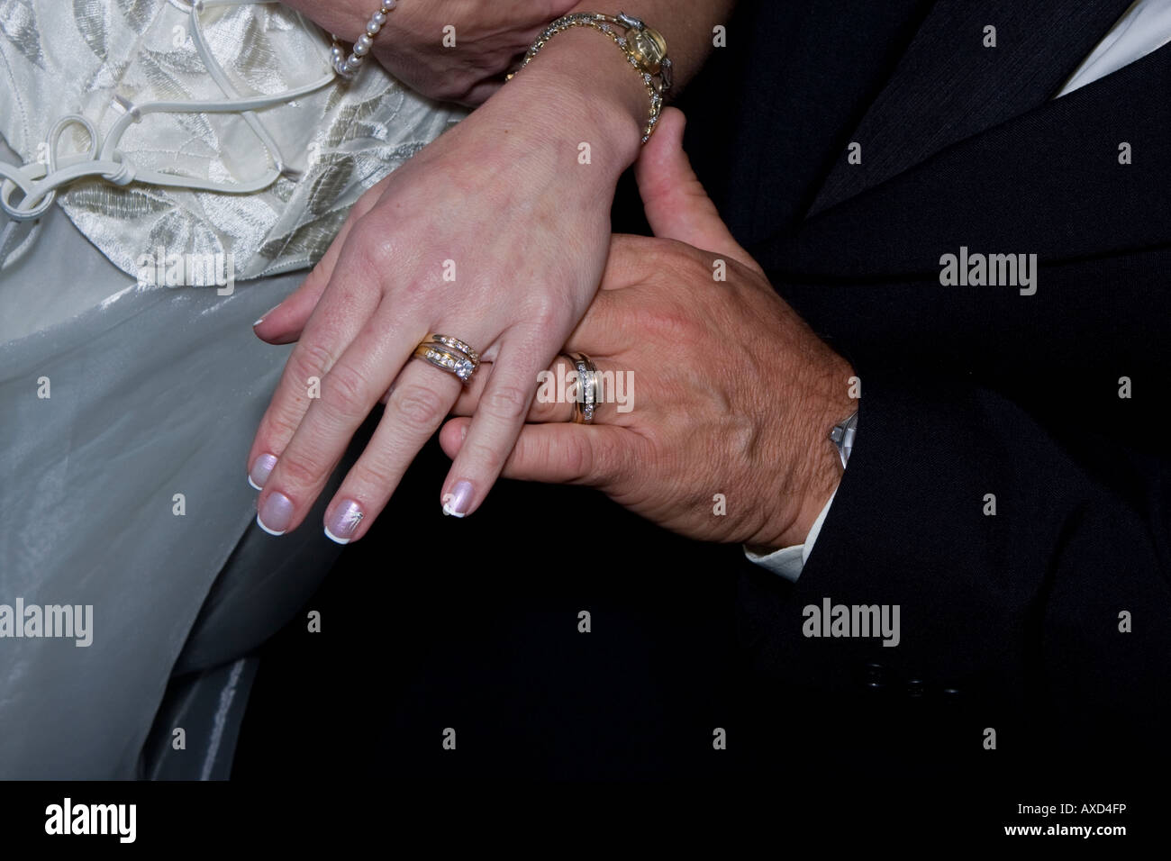 Bride and Groom Showing their Wedding Rings Stock Photo - Alamy