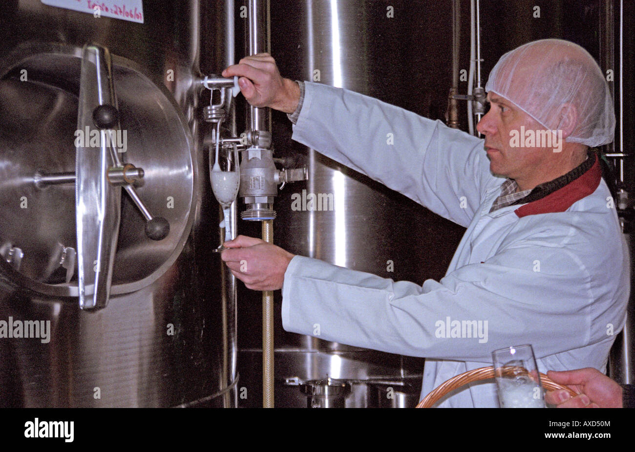 Fermentation tanks. Sampling. Emilio Kunz, oenologist and owner at ...