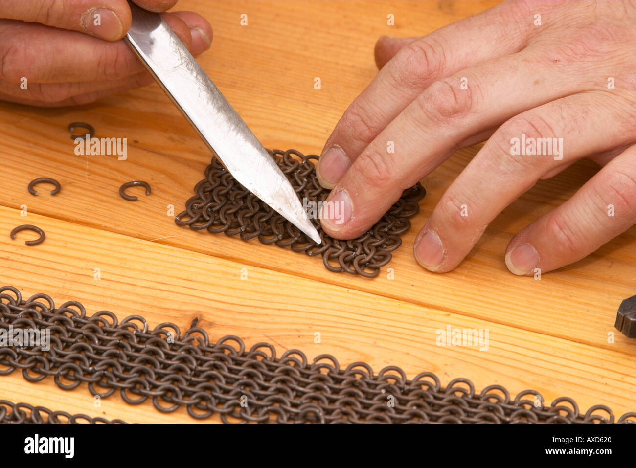 Members of Comitatus Roman Living History Wroxeter Making chainmail ...