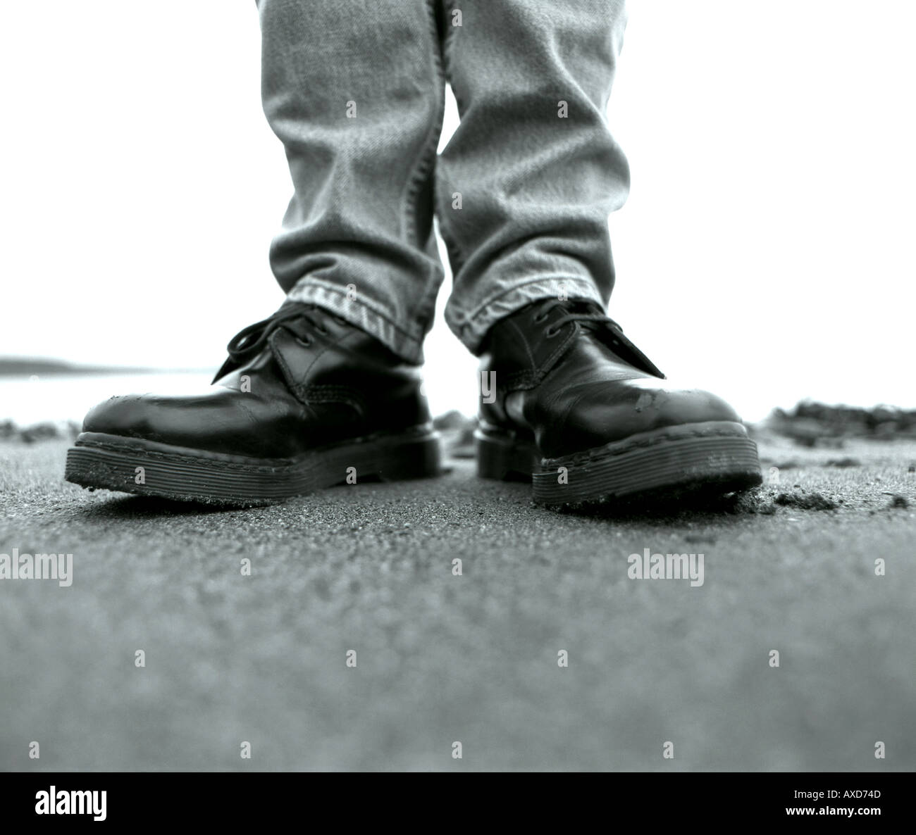 Wearing boots standing on beach hi-res stock photography and images - Alamy