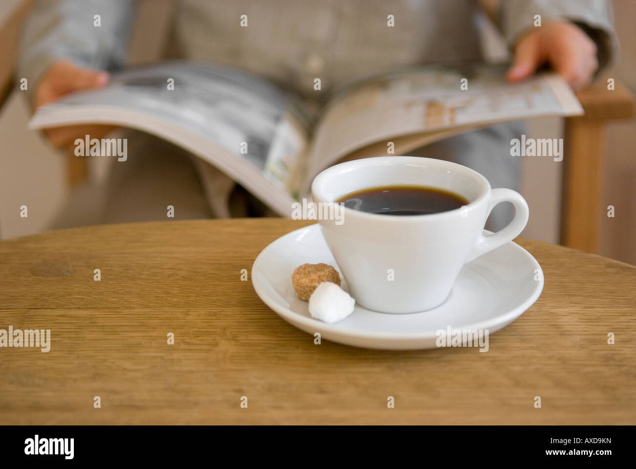 Woman reading magazine Stock Photo - Alamy