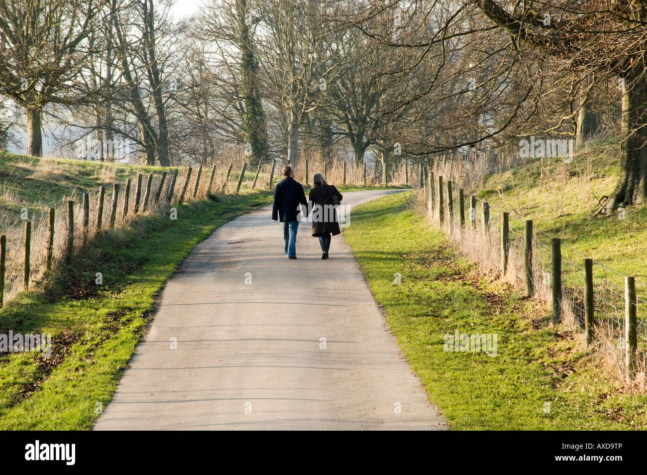 Man and woman walking in country lane hi-res stock photography and ...