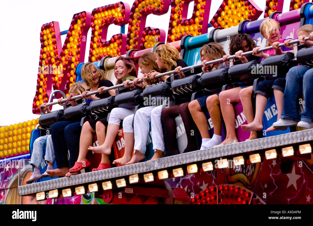 Teenagers on MEGA DANCE fair ride during Newent Onion Fayre Newent ...