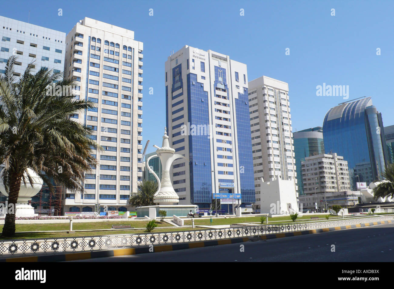 Street in centre of Abu Dhabi capital of the UAE. The white sculptures ...