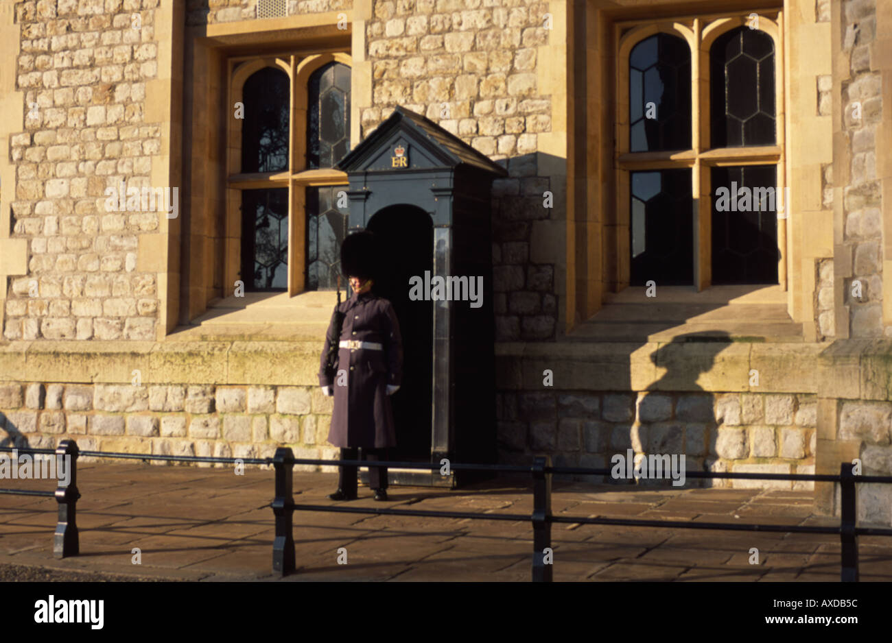 Guard standing in a sentry box guarding the building where the crown ...