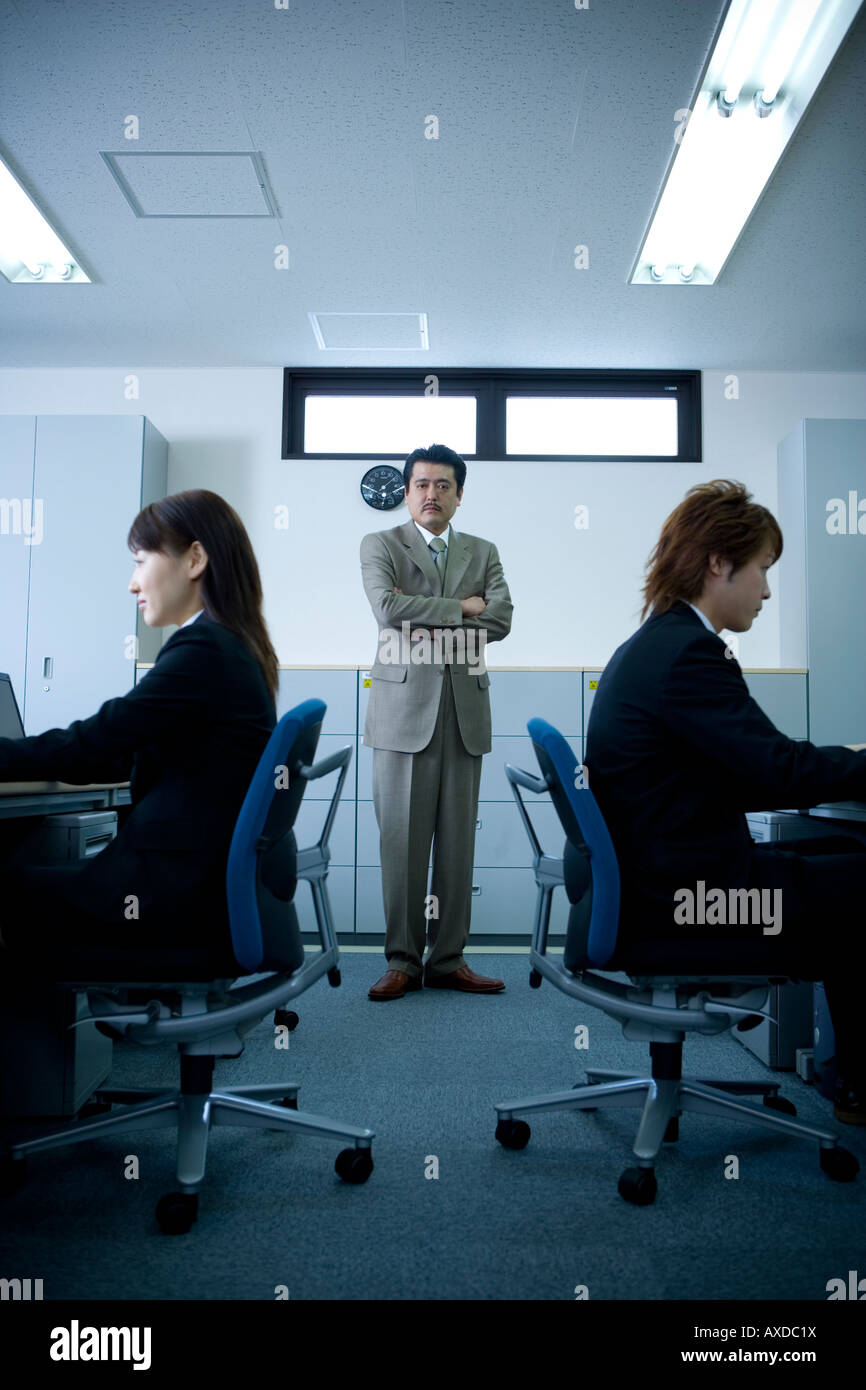 Three people working in office Stock Photo - Alamy
