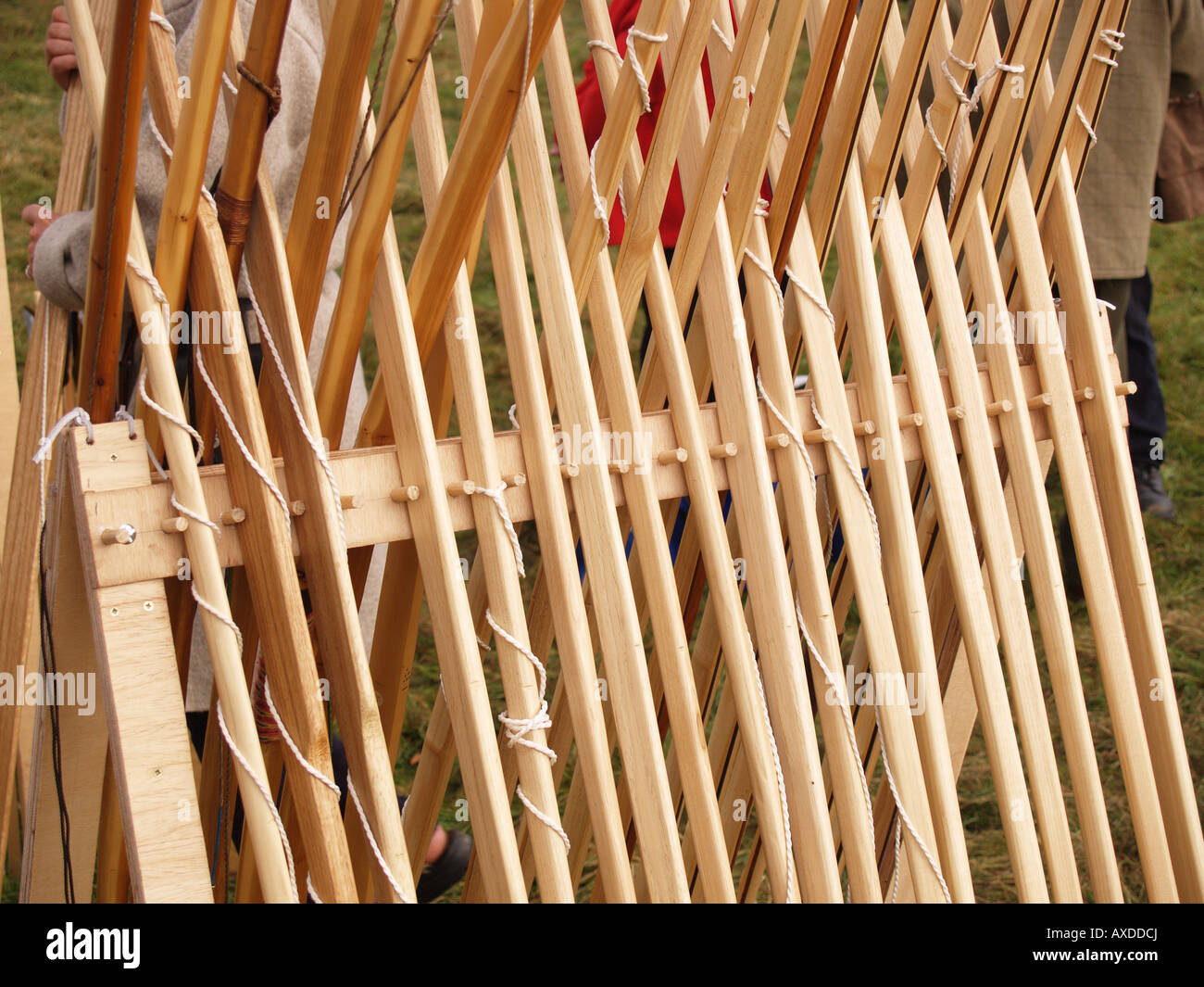 cross rack frame of wooden spears upwards many Stock Photo - Alamy