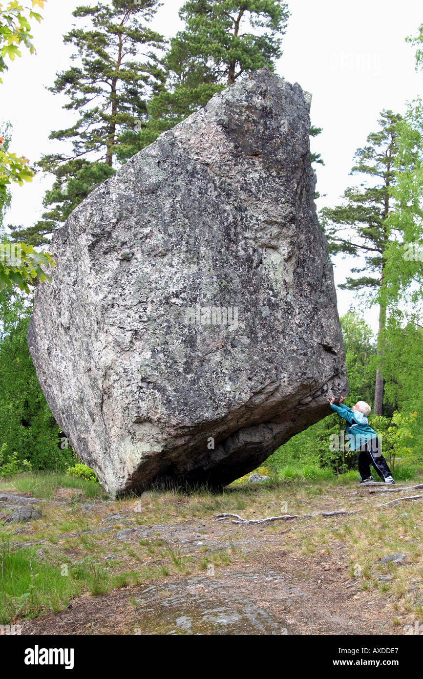 Boy lifting rock hi-res stock photography and images - Alamy