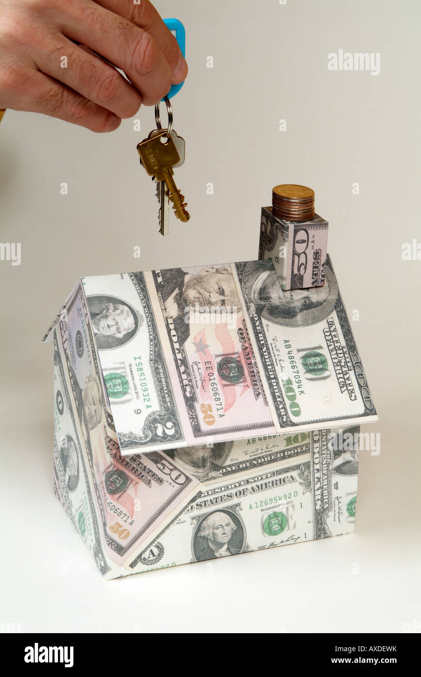 American dollars housing market Hand holding house keys Stock Photo - Alamy