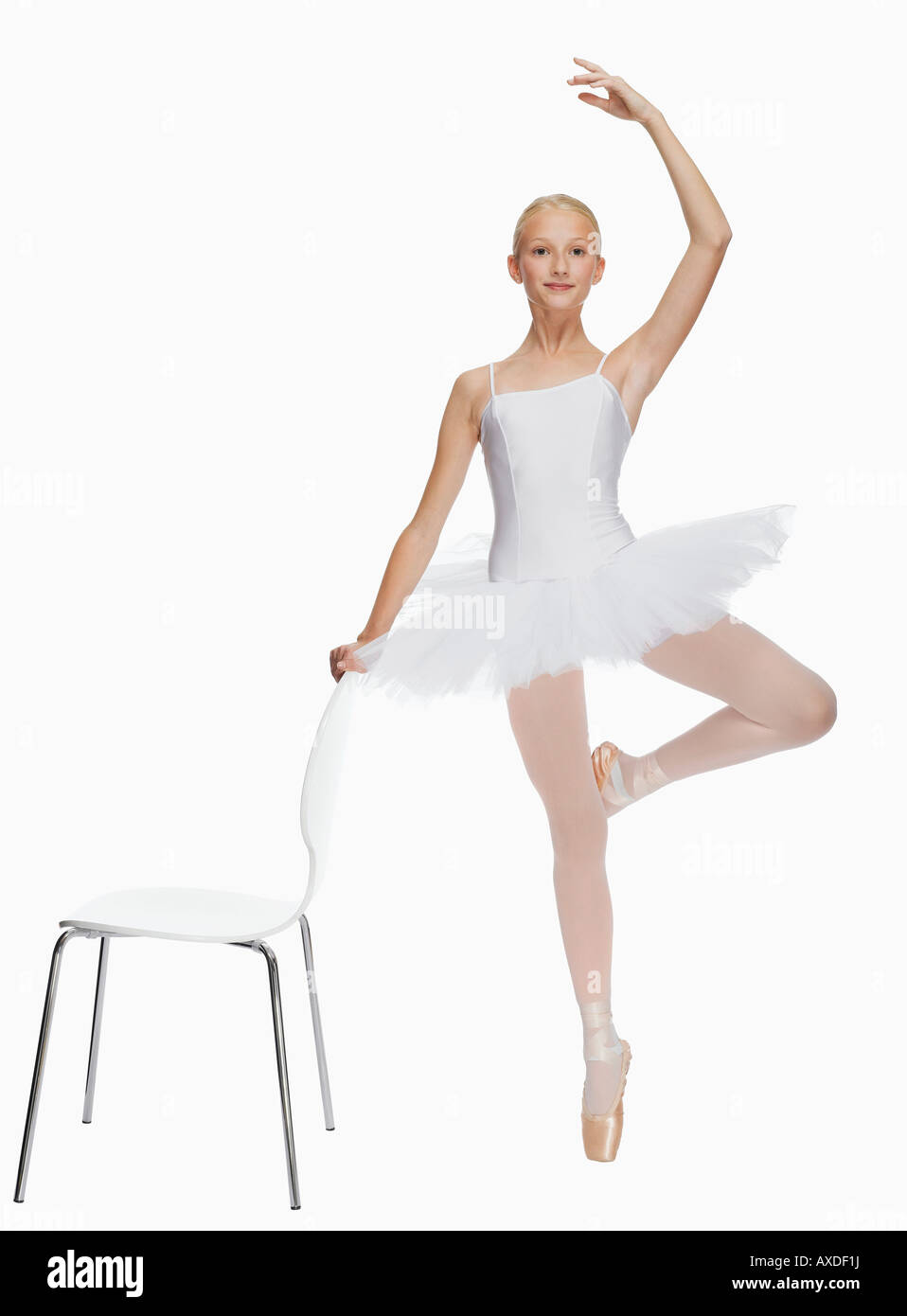 Young ballerina (14-15) standing on pointe in toe shoes,, portrait ...