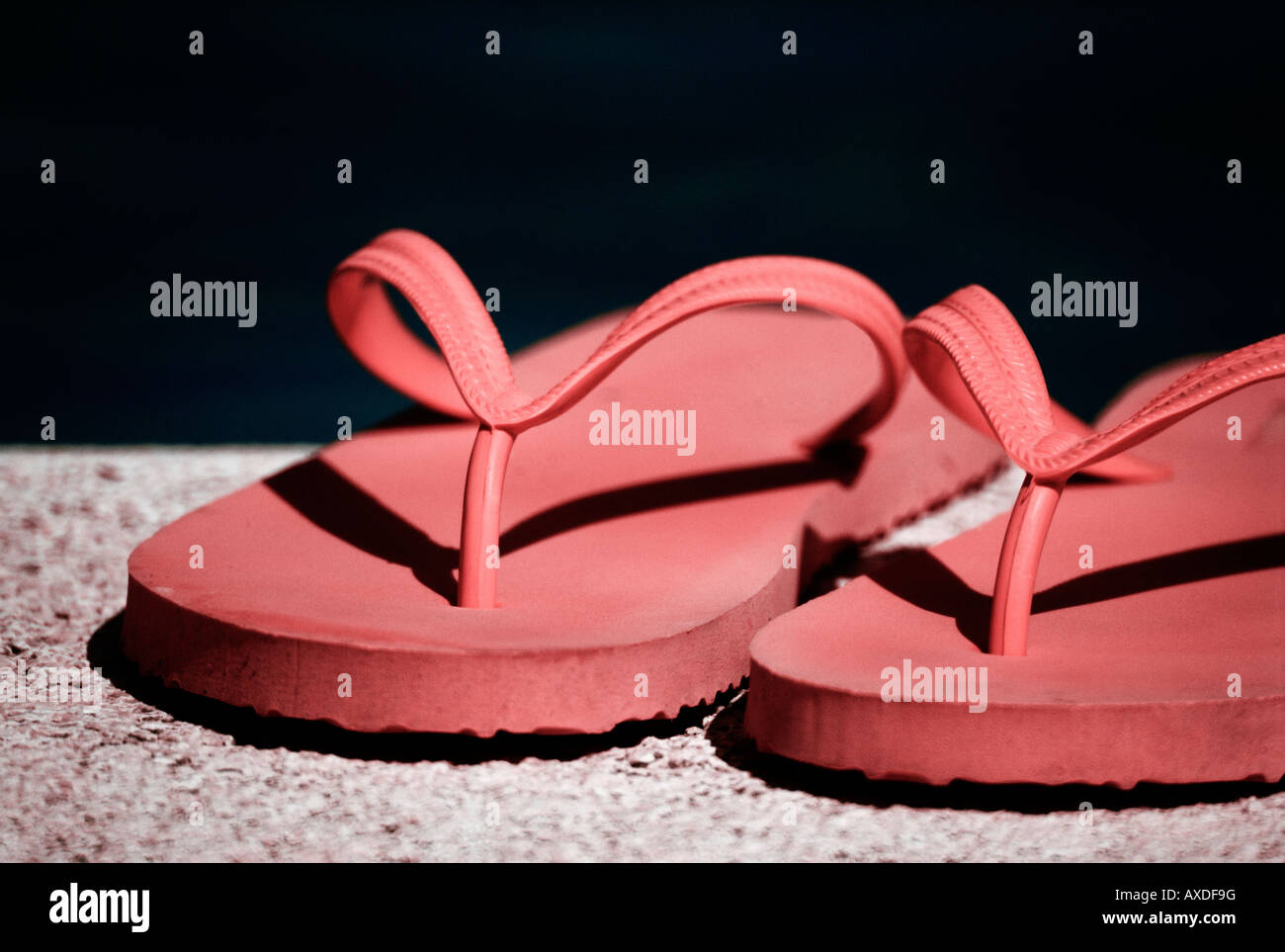 Closeup view of flip flops by the pool Stock Photo - Alamy
