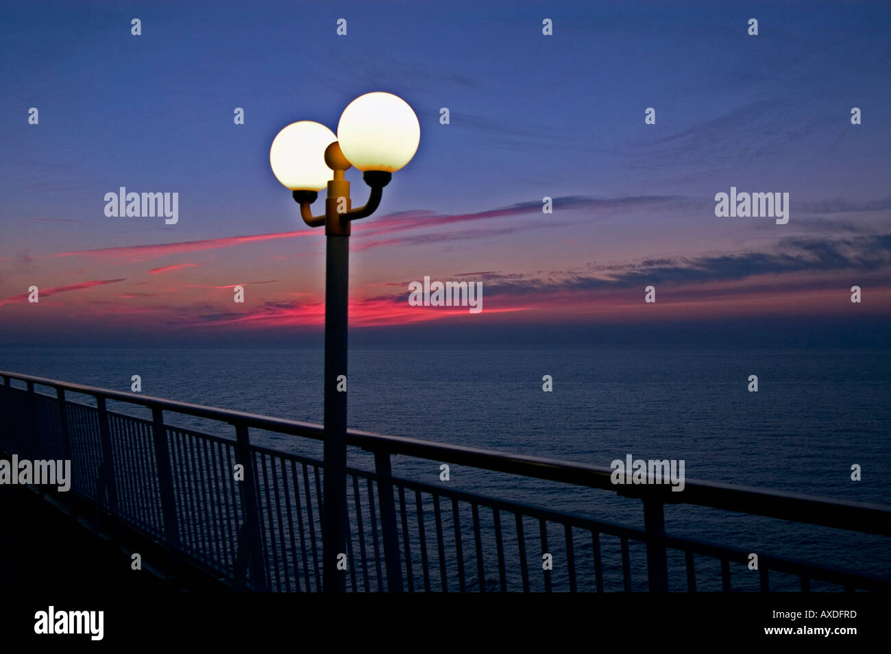 Illuminating lamps on deck and sunset Norwegian Dawn Cruise Ship Stock ...