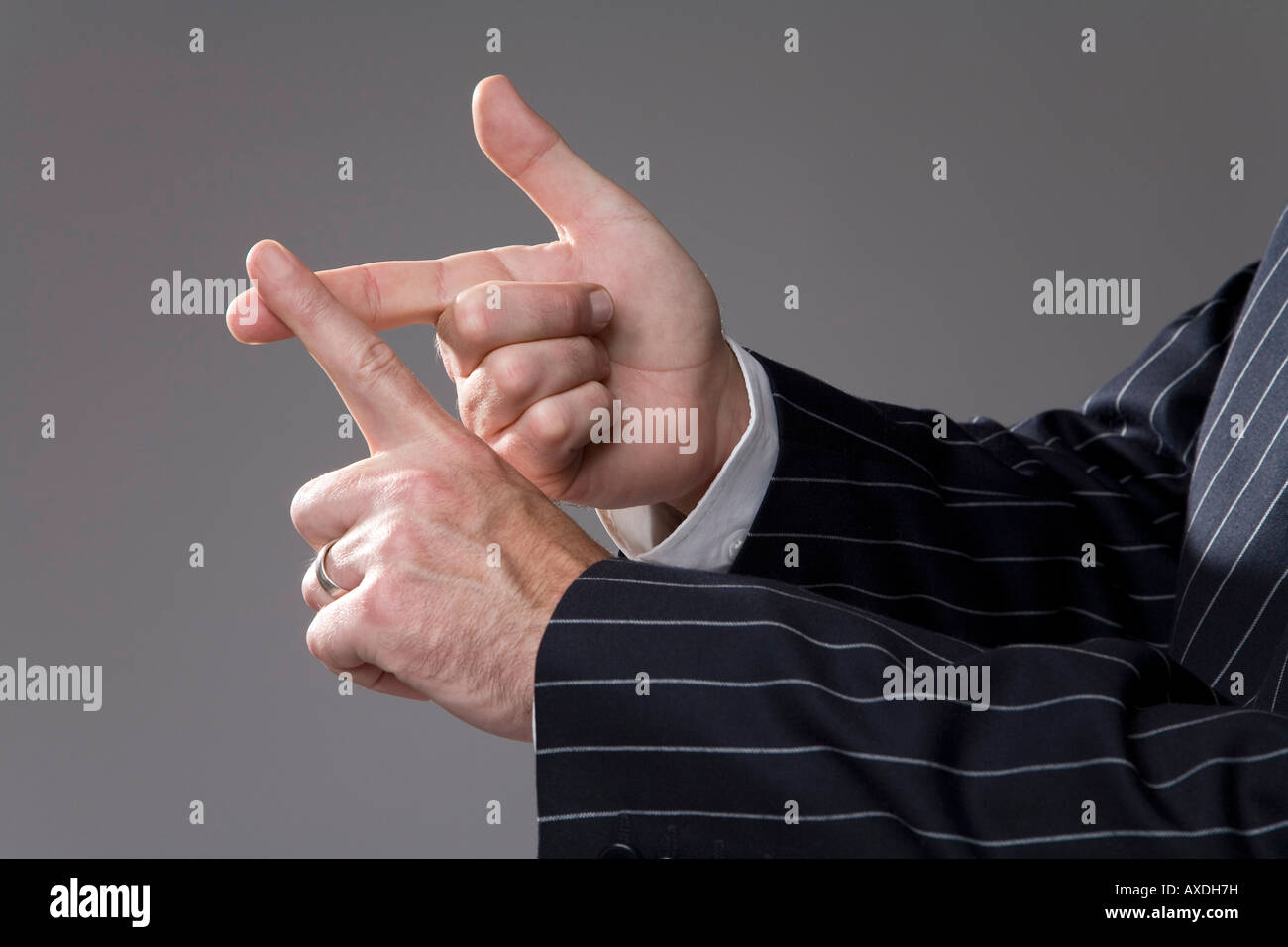 Man making hand gesture, counting, close-up Stock Photo - Alamy